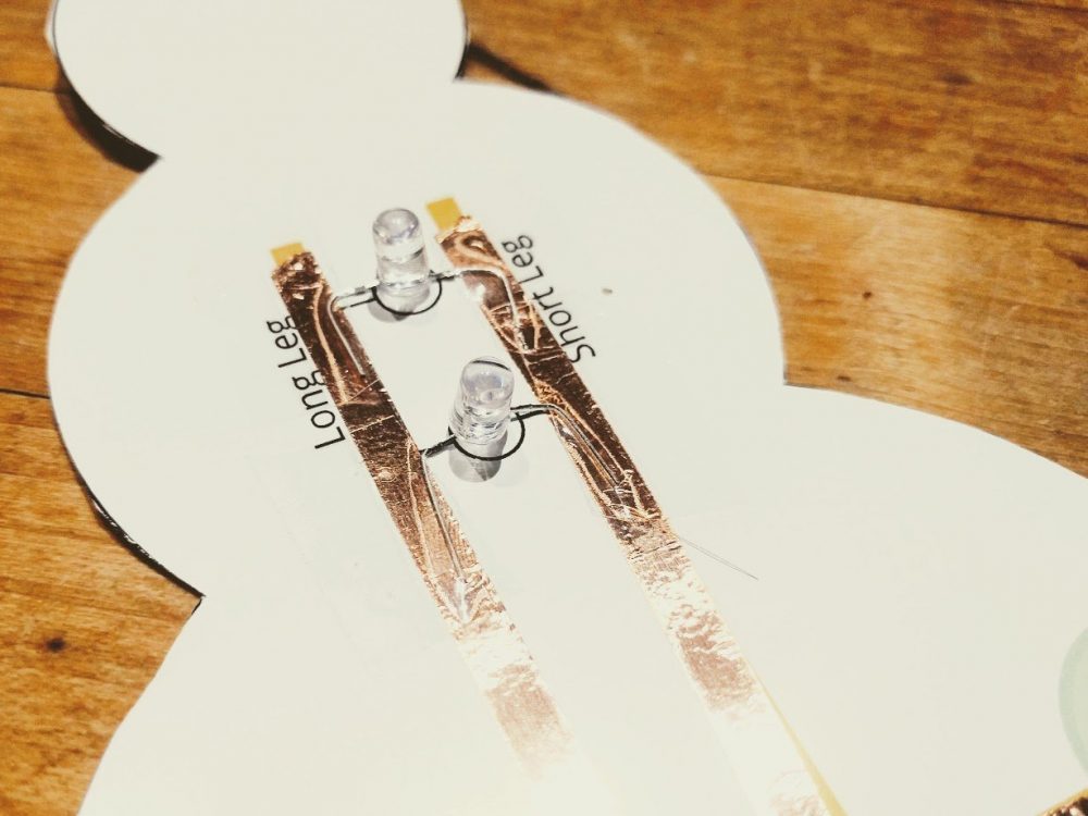 A paper circuit snowman makes great holiday decorations for kids